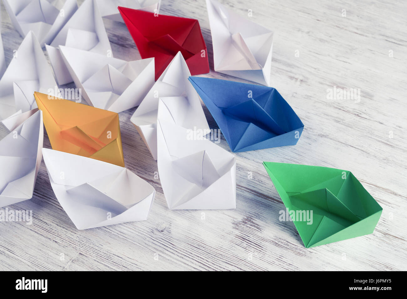Business leadership concept with white and color paper boats on Stock ...