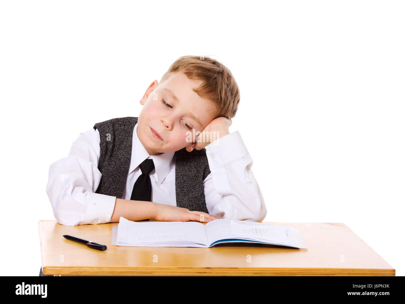 Upset schoolboy doing homework isolated on white Stock Photo - Alamy