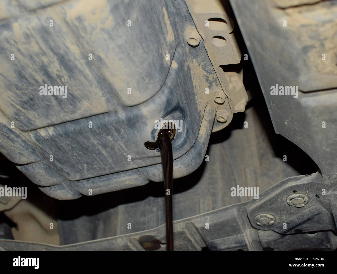 Drain the old oil from the engine through the drain plug. Changing the ...