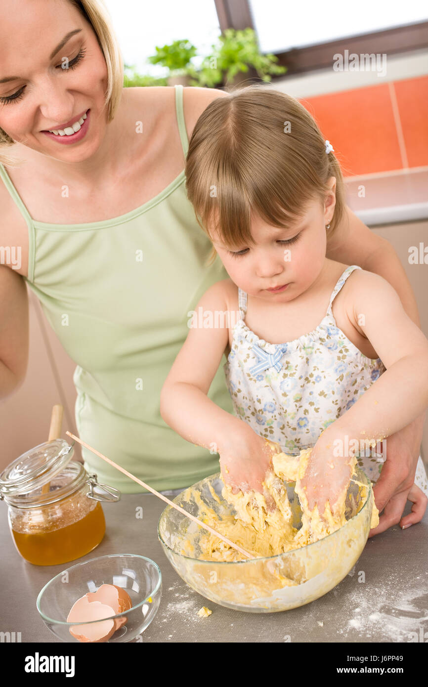 Child mother baking honey hi-res stock photography and images - Alamy