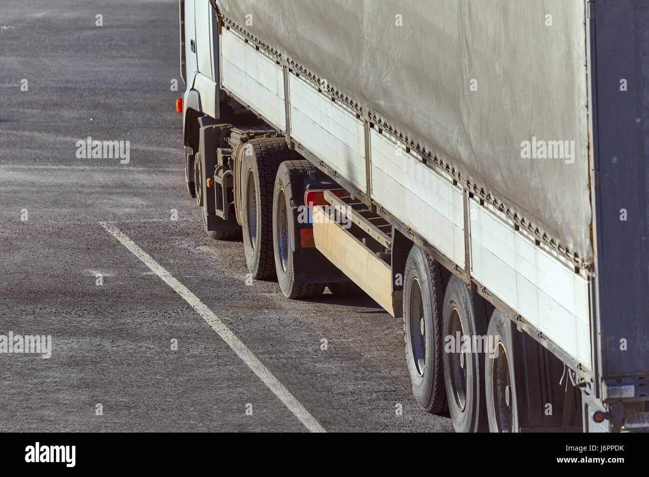 Parking trucks wheels close up Stock Photo - Alamy