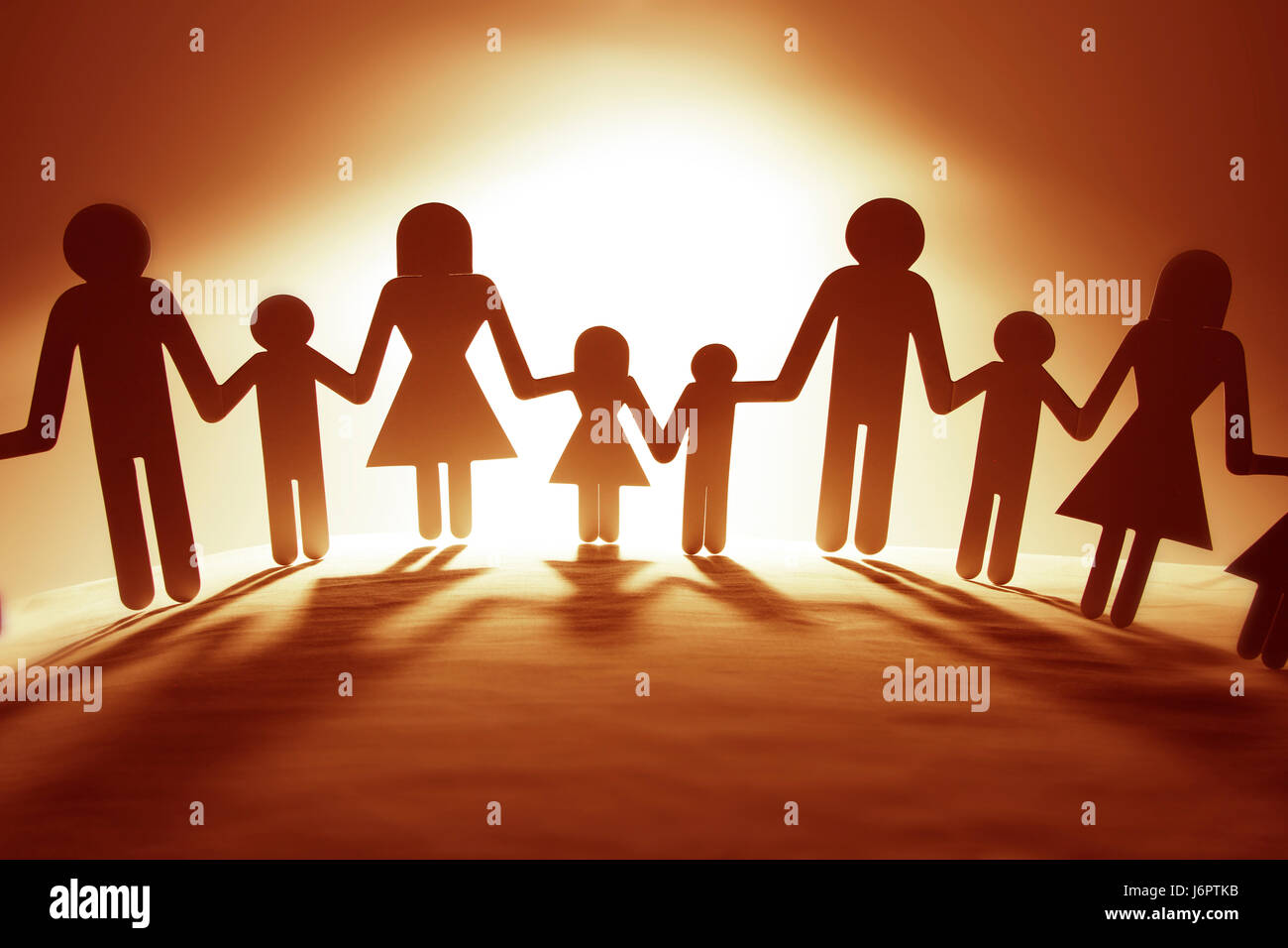 Family paper chain cutout holding hands Stock Photo - Alamy