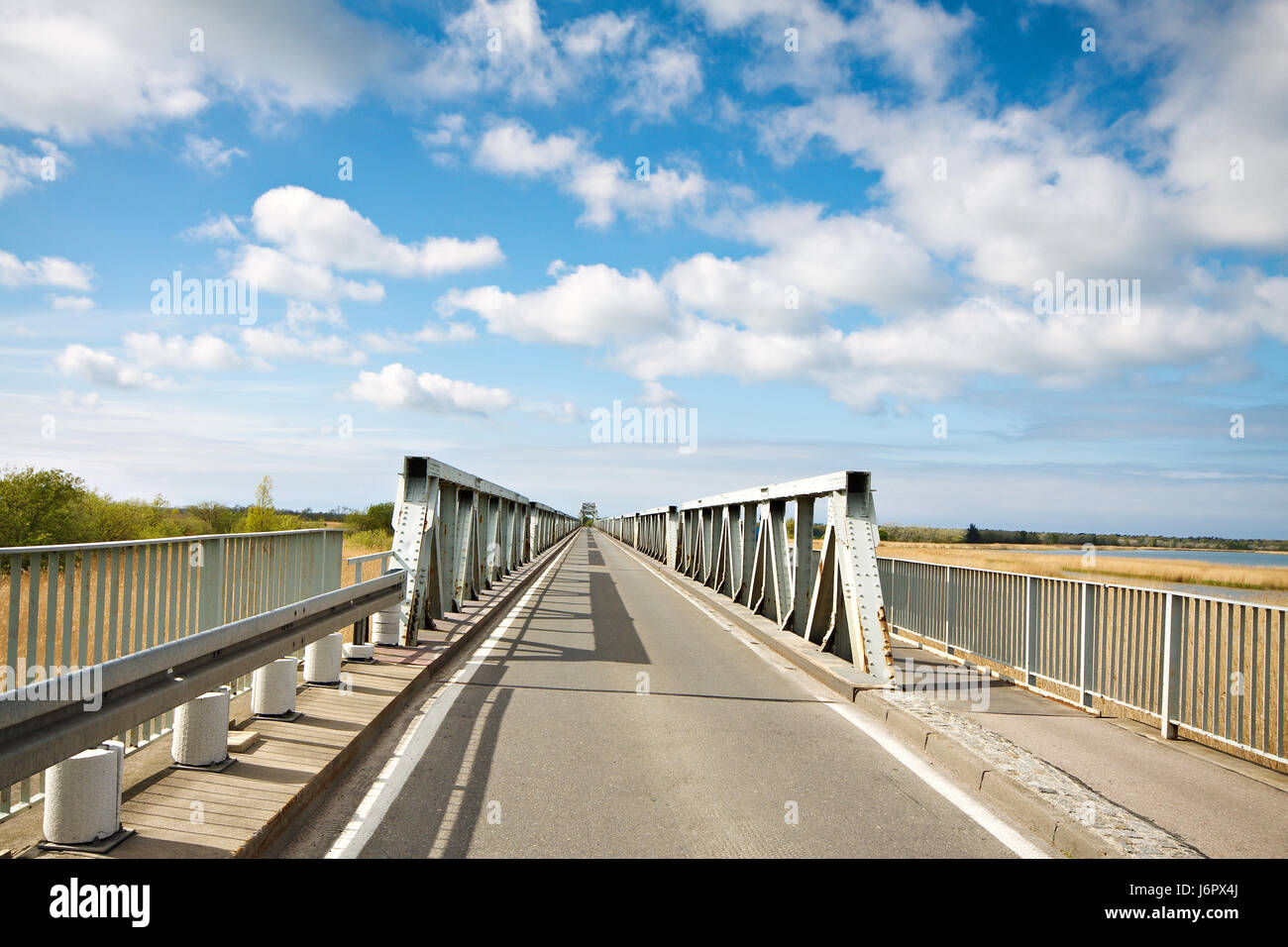 blue waters bridge reed firmament sky salt water sea ocean water street ...