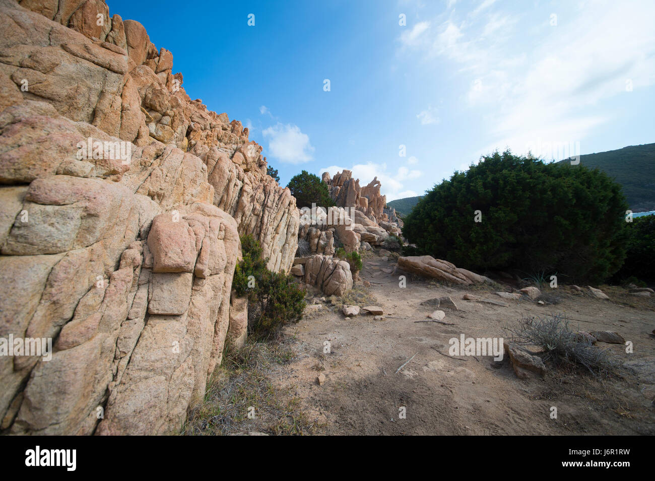 Huge rocky rocks on the coast of Sardinia in Italy Stock Photo - Alamy