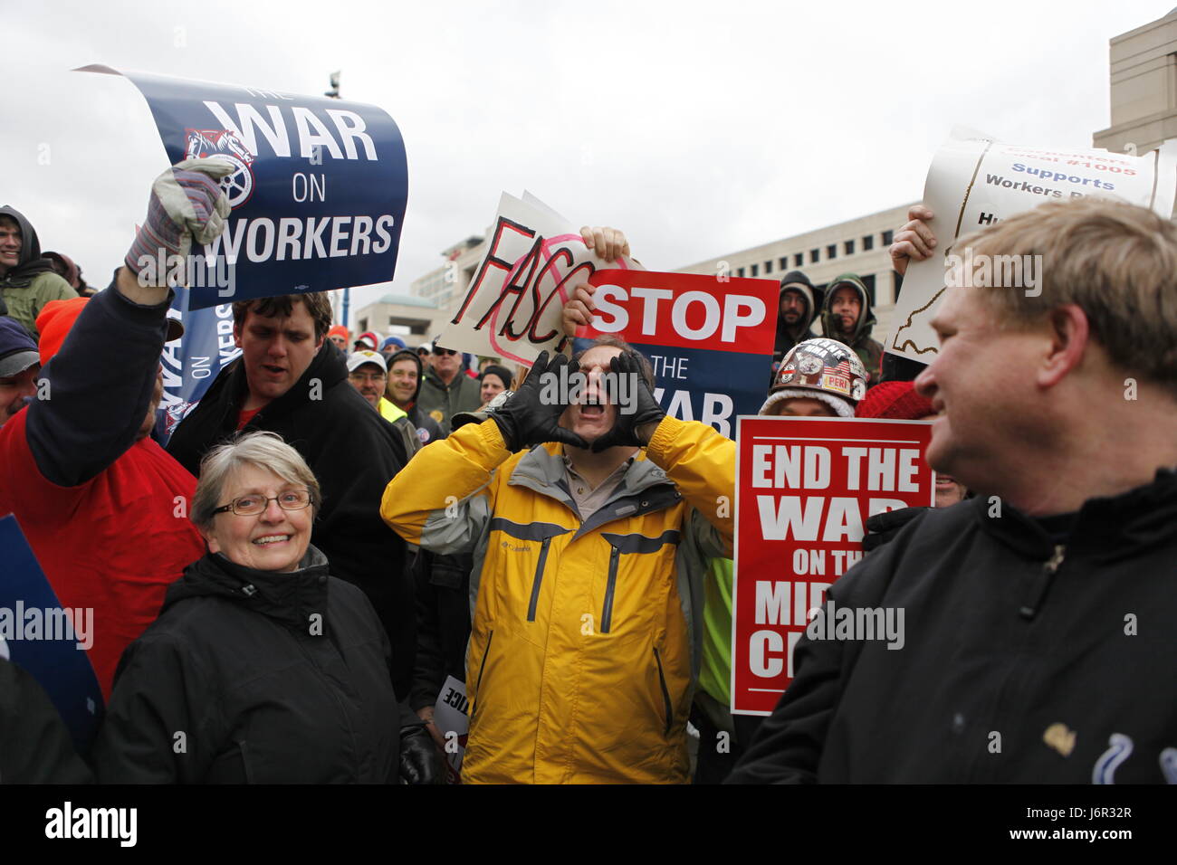 An anti-union agitator, center, who would only gave his name as Ron and ...