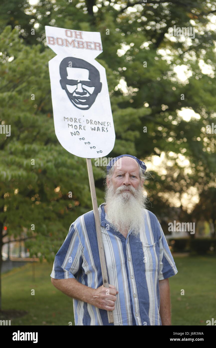 Ned Powell holds a sign referring to Obama as, "Oh Bomber," during a ...