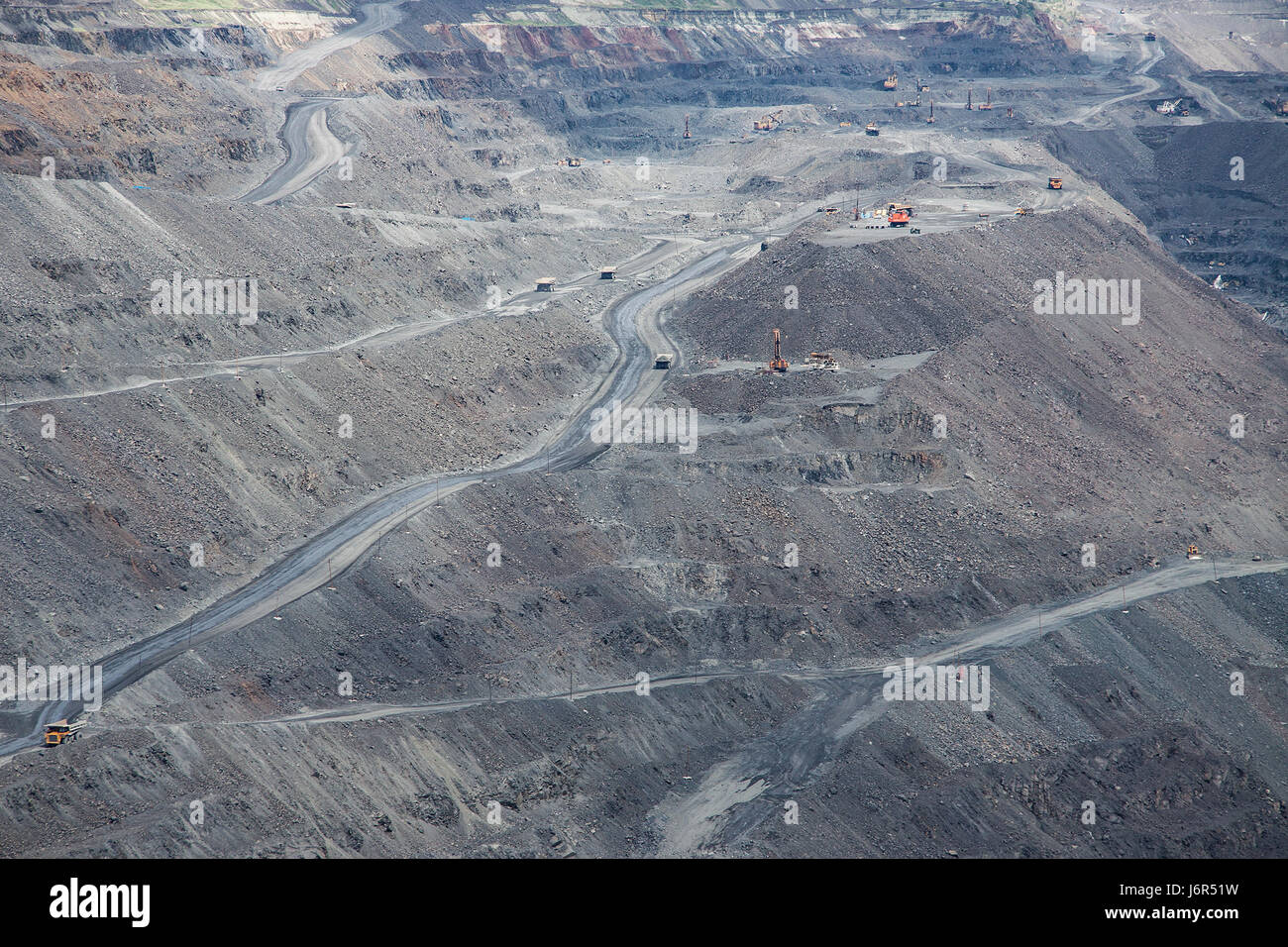 View to the iron ore mining with roads and machinery Stock Photo - Alamy