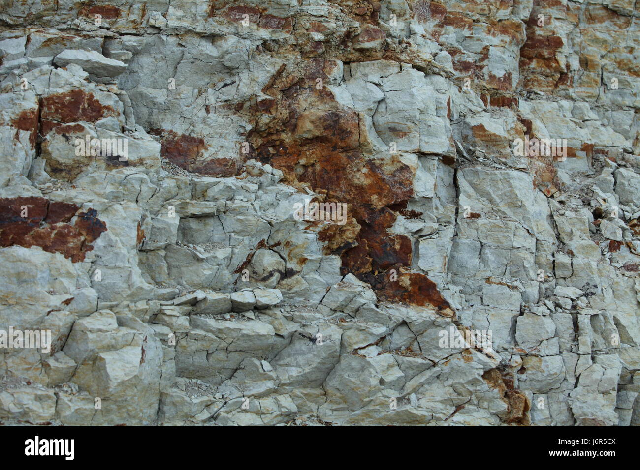 cracked surface of the blue clay with Fe oxides Stock Photo - Alamy