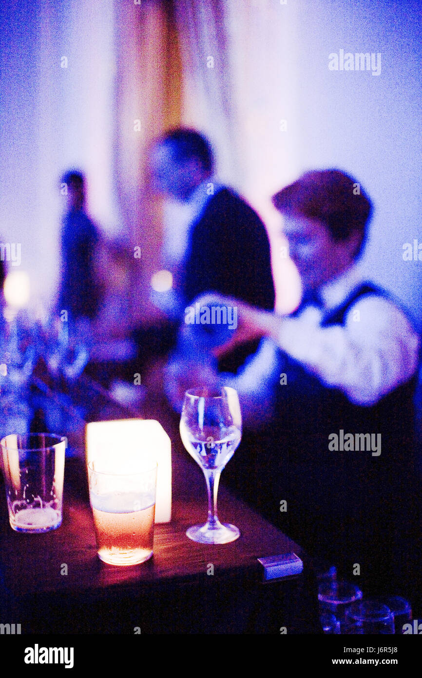 VIP wedding party evening marriage drinks reception with waiter and bar ...