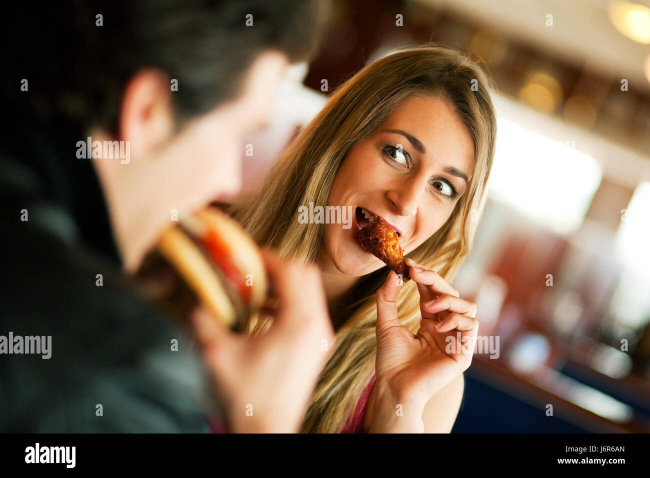 couple in restaurant drinking me shake Stock Photo - Alamy