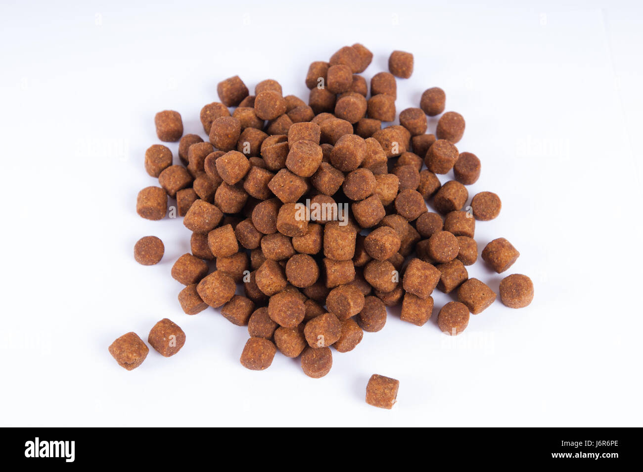 Dry dog food granules isolated on white background top view Stock Photo ...