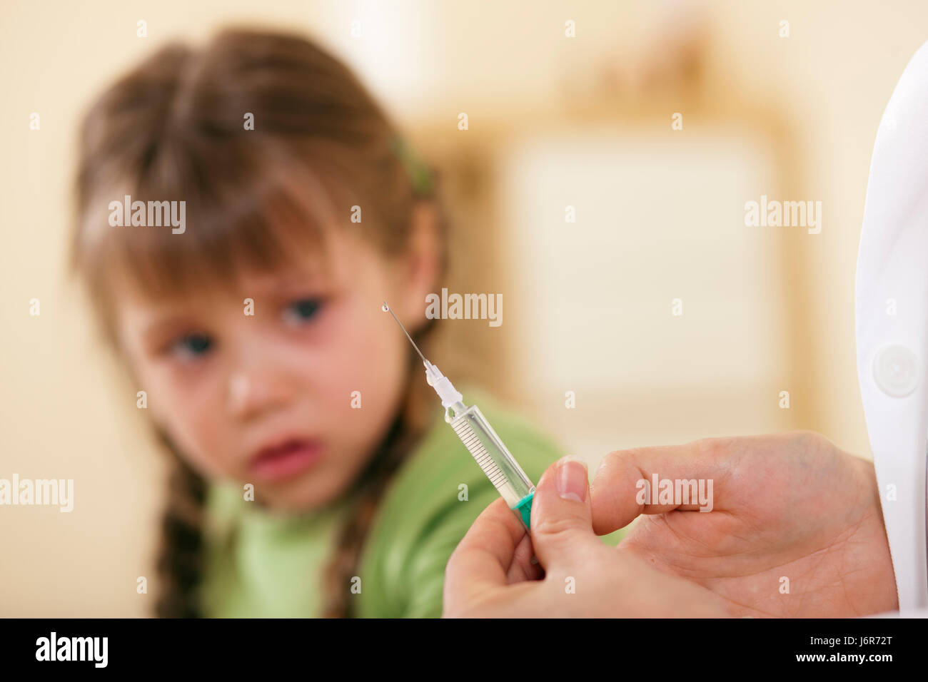 pediatricians are child an injection Stock Photo - Alamy