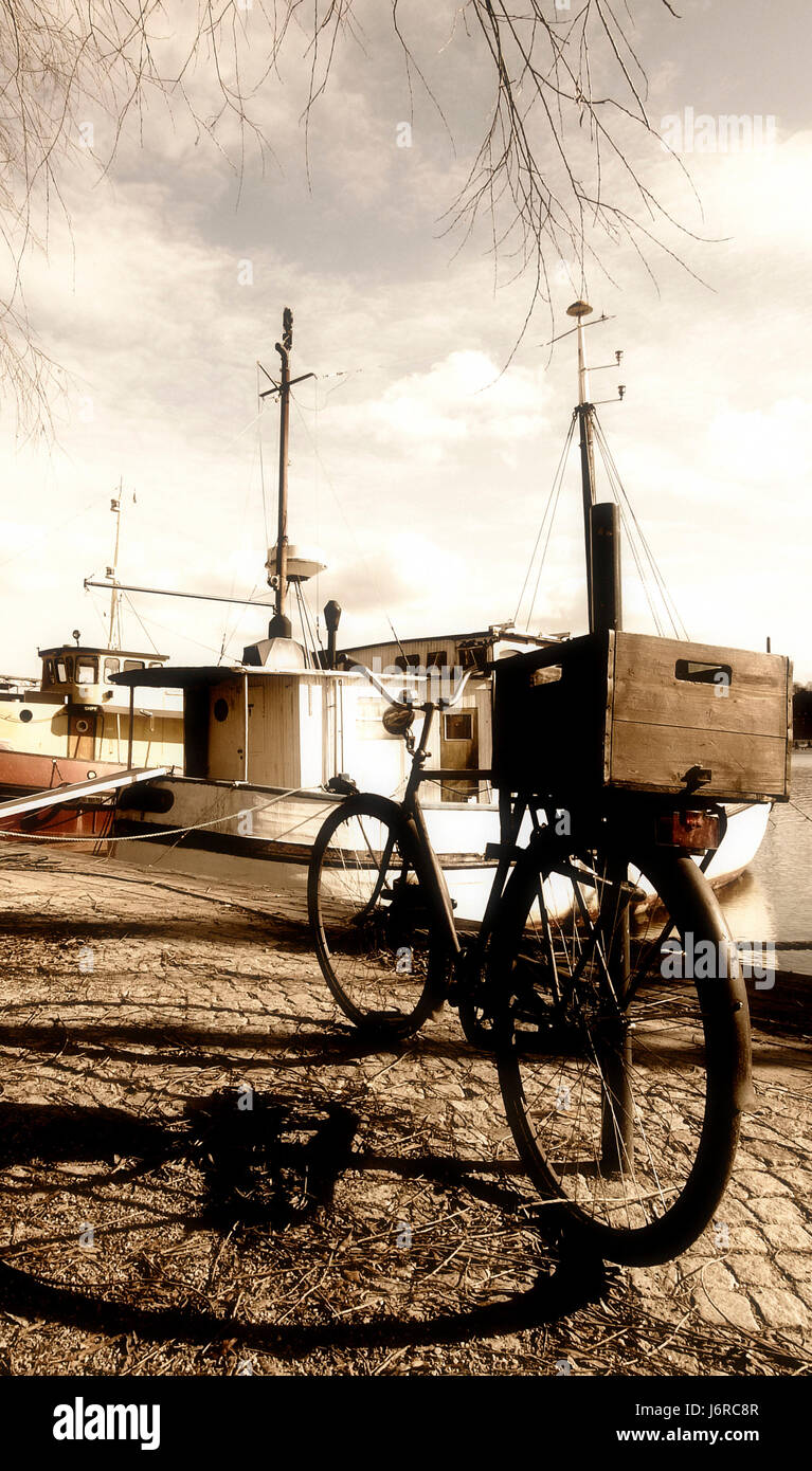 wheel stockholm stockhom pier dock bike bicycle cycle water rowing boat ...