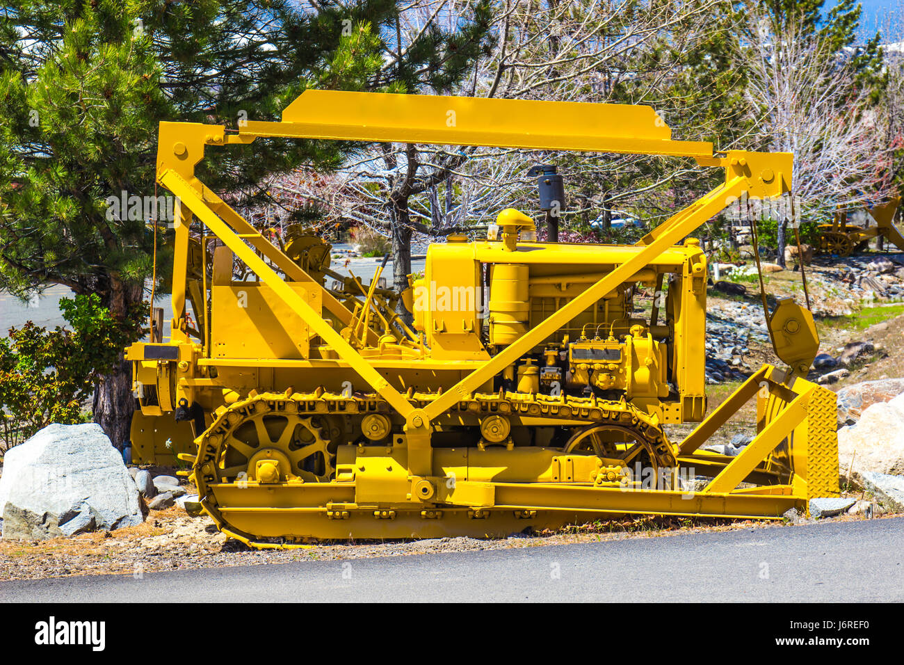 Antique Yellow Bulldozer With Iron Treads Stock Photo - Alamy
