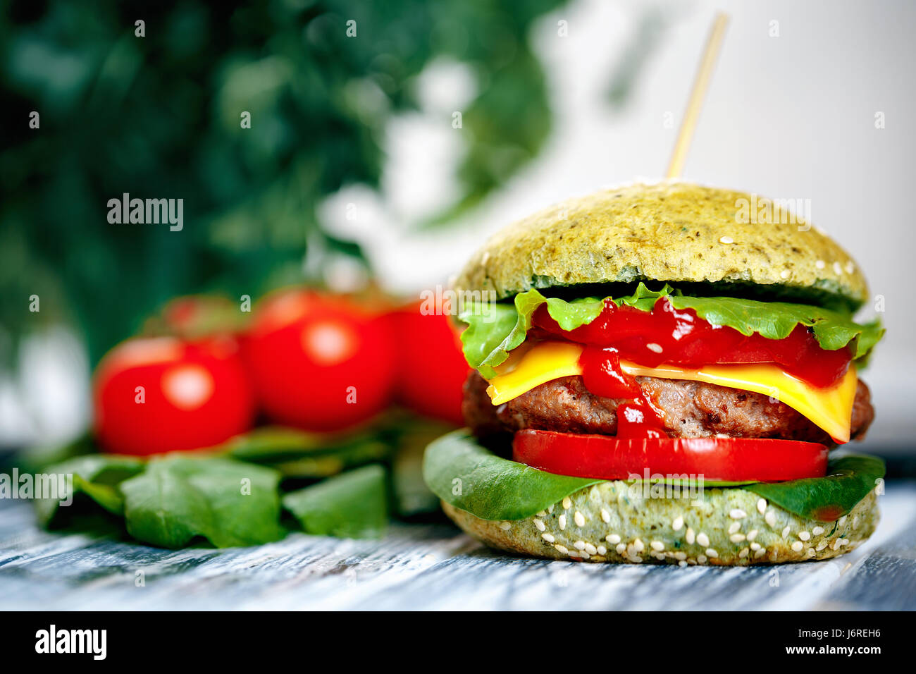 burger with green bun and fresh vegetables Stock Photo - Alamy