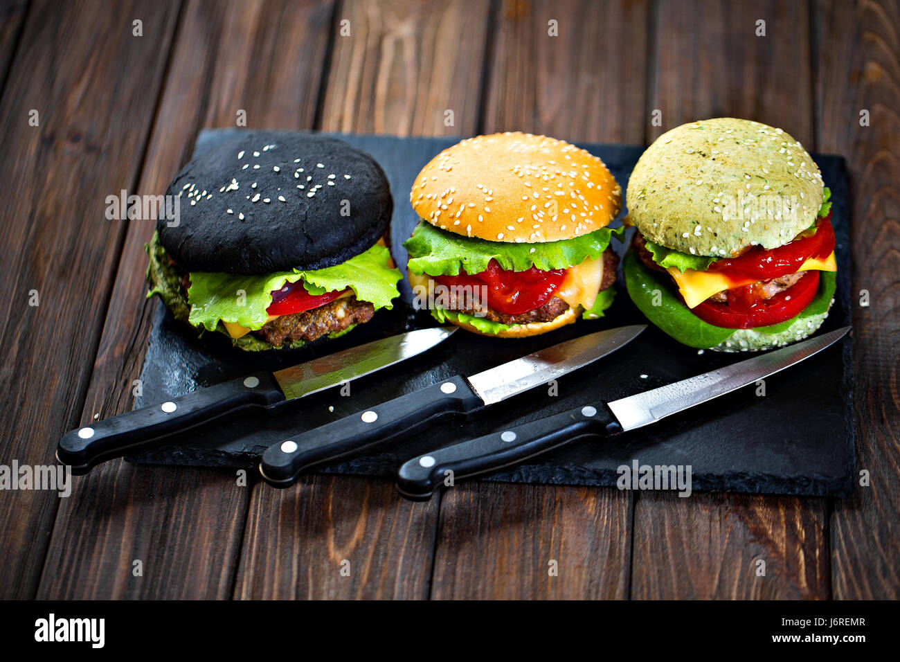 Three delicious burgers Stock Photo - Alamy