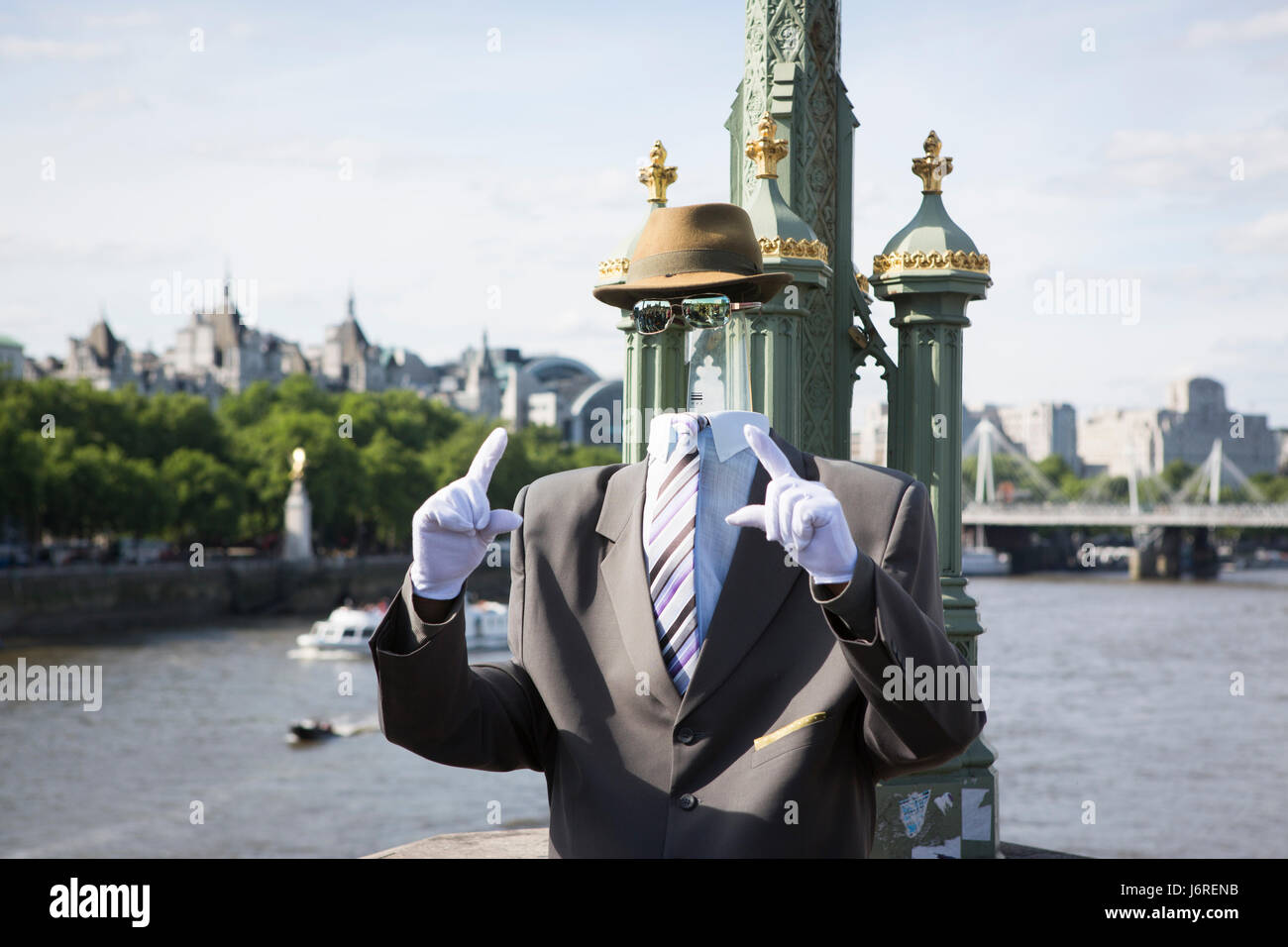 Street Artist, Magritte inspiration in Westminster Stock Photo - Alamy