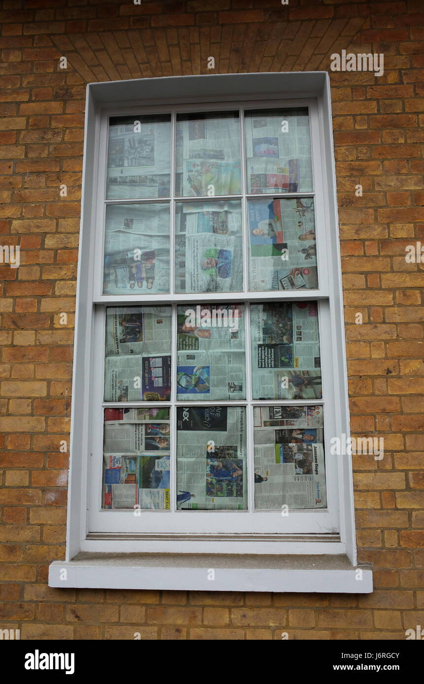 Window with newspapers hi-res stock photography and images - Alamy
