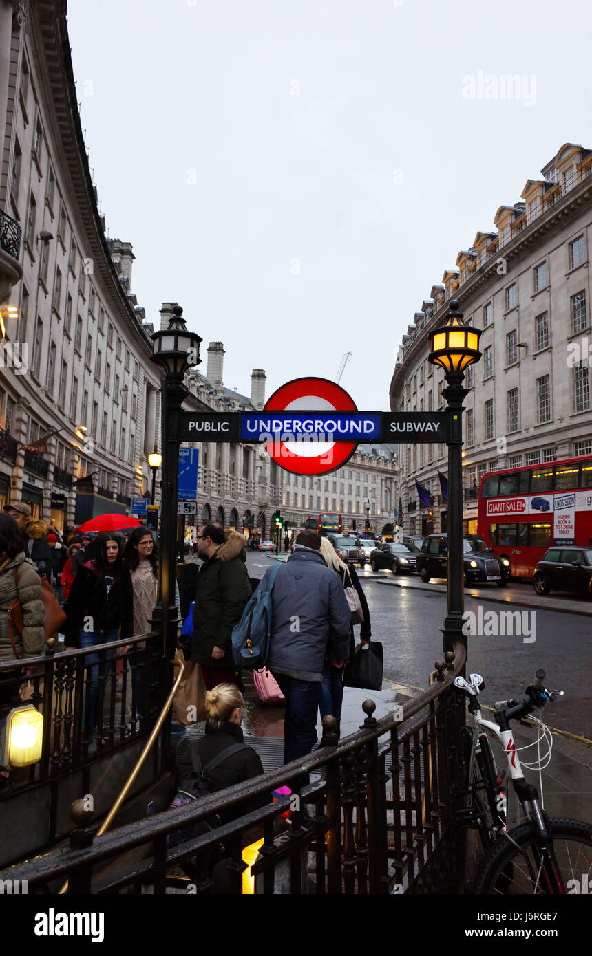 people walking up steps of Piccadilly Circus underground station on to Regent Street, London, UK ...