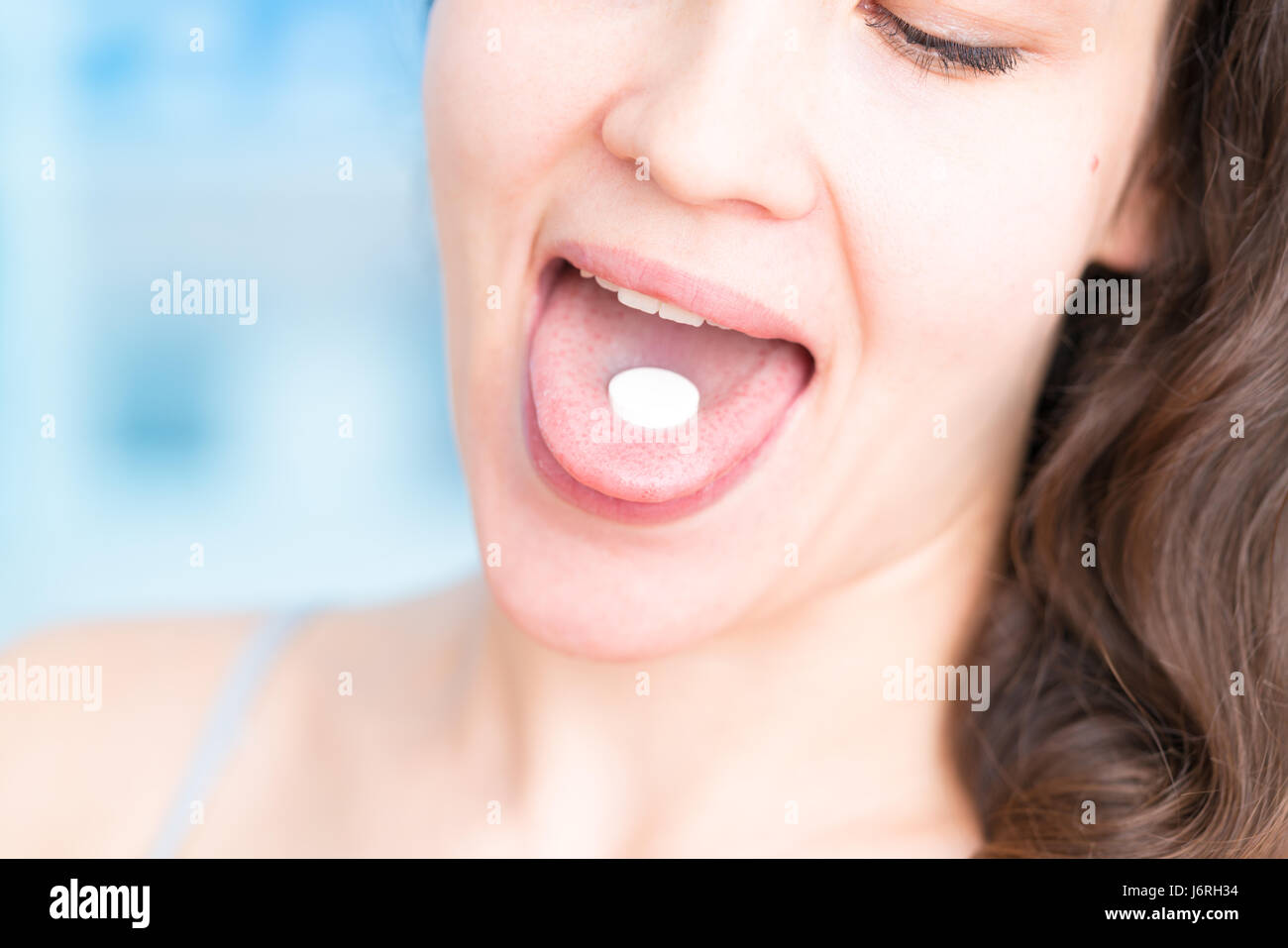 Girl taking tablet medication hi-res stock photography and images - Alamy