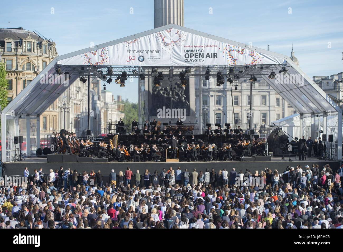 Members of the public watch the London Symphony Orchestra play a ...