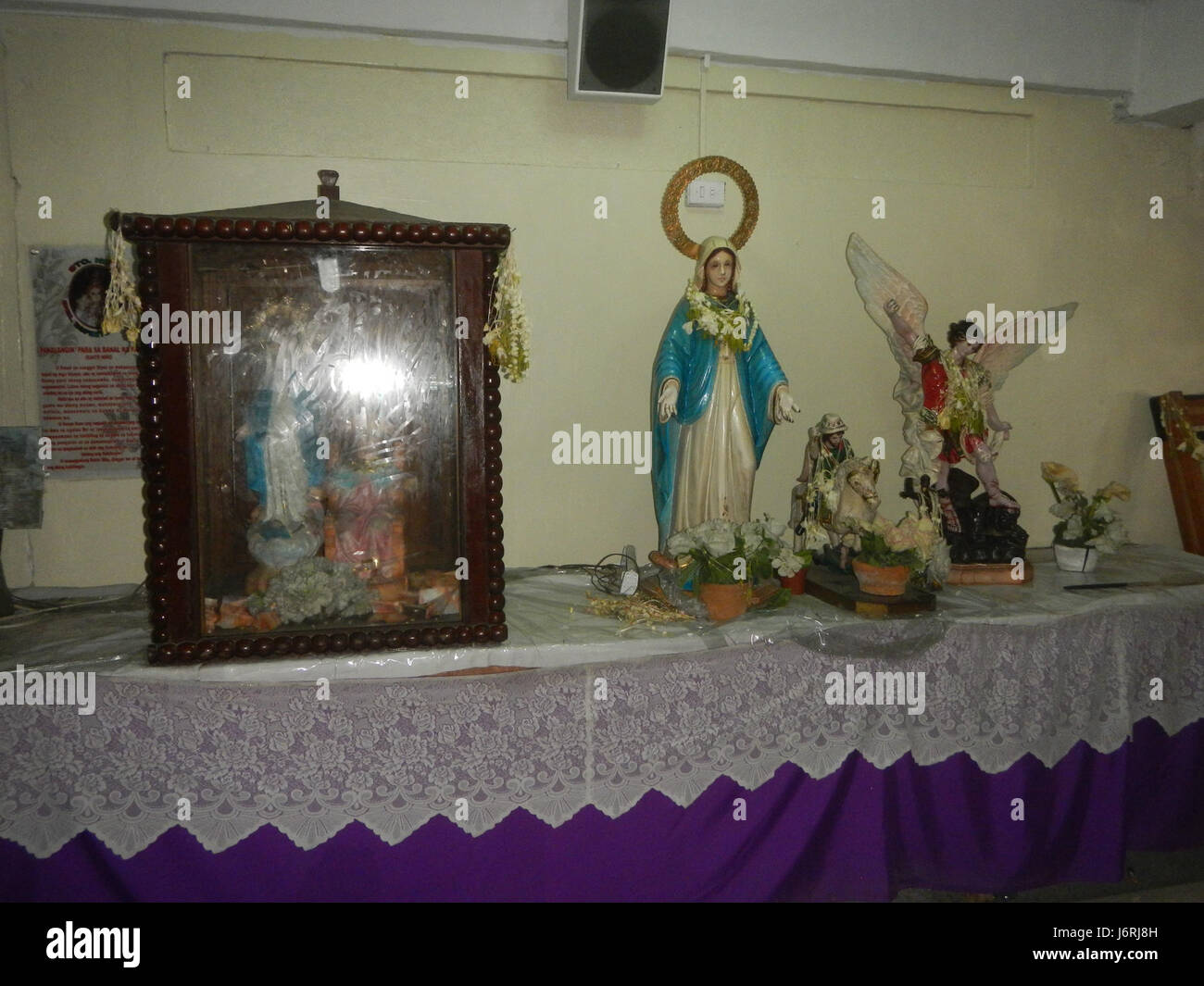 This photograph captures the Pasyon Pabasa at the Holy Trinity Chapel ...