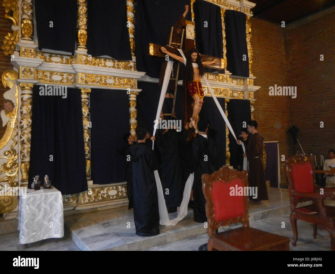 This image captures the veneration of the Cross during Good Friday ...