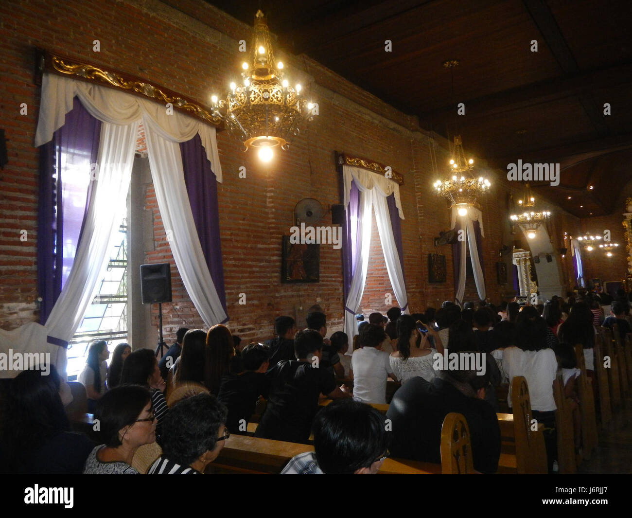 This photograph documents the Veneration Cross ceremony on Good Friday ...