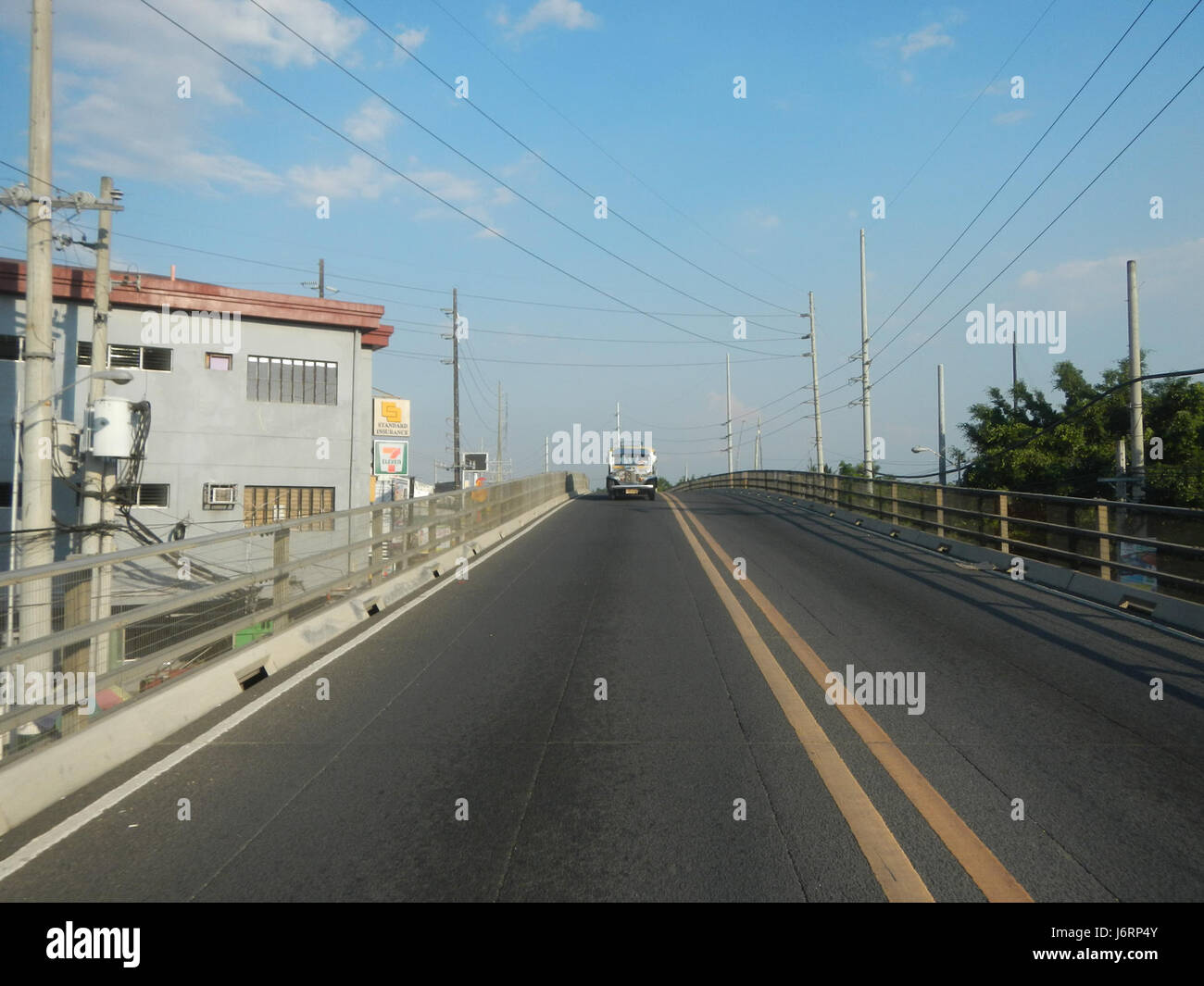 This photograph captures the overpass bridge in Malolos City, located ...