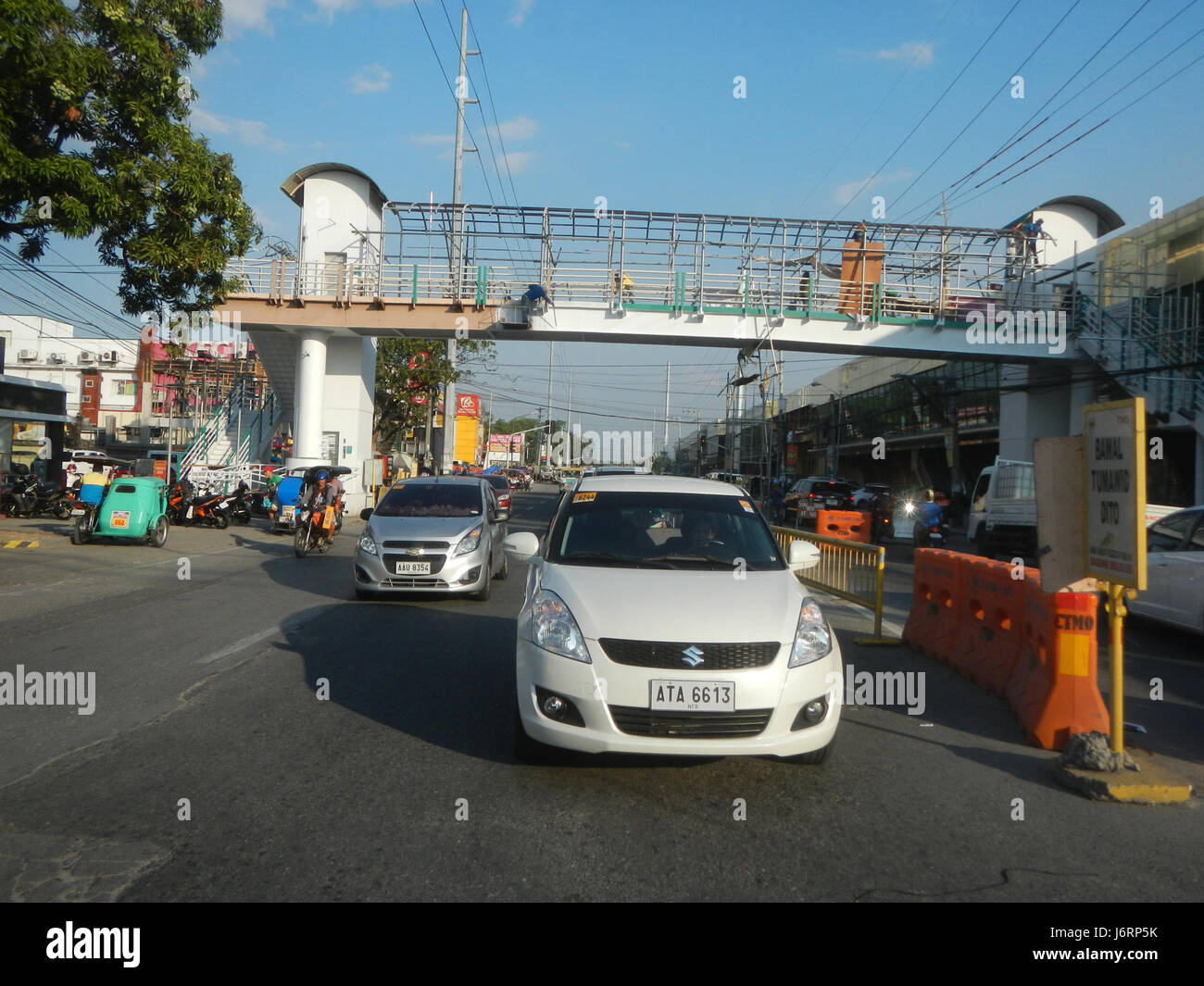 The image depicts the Malolos City overpass bridge, located along the ...