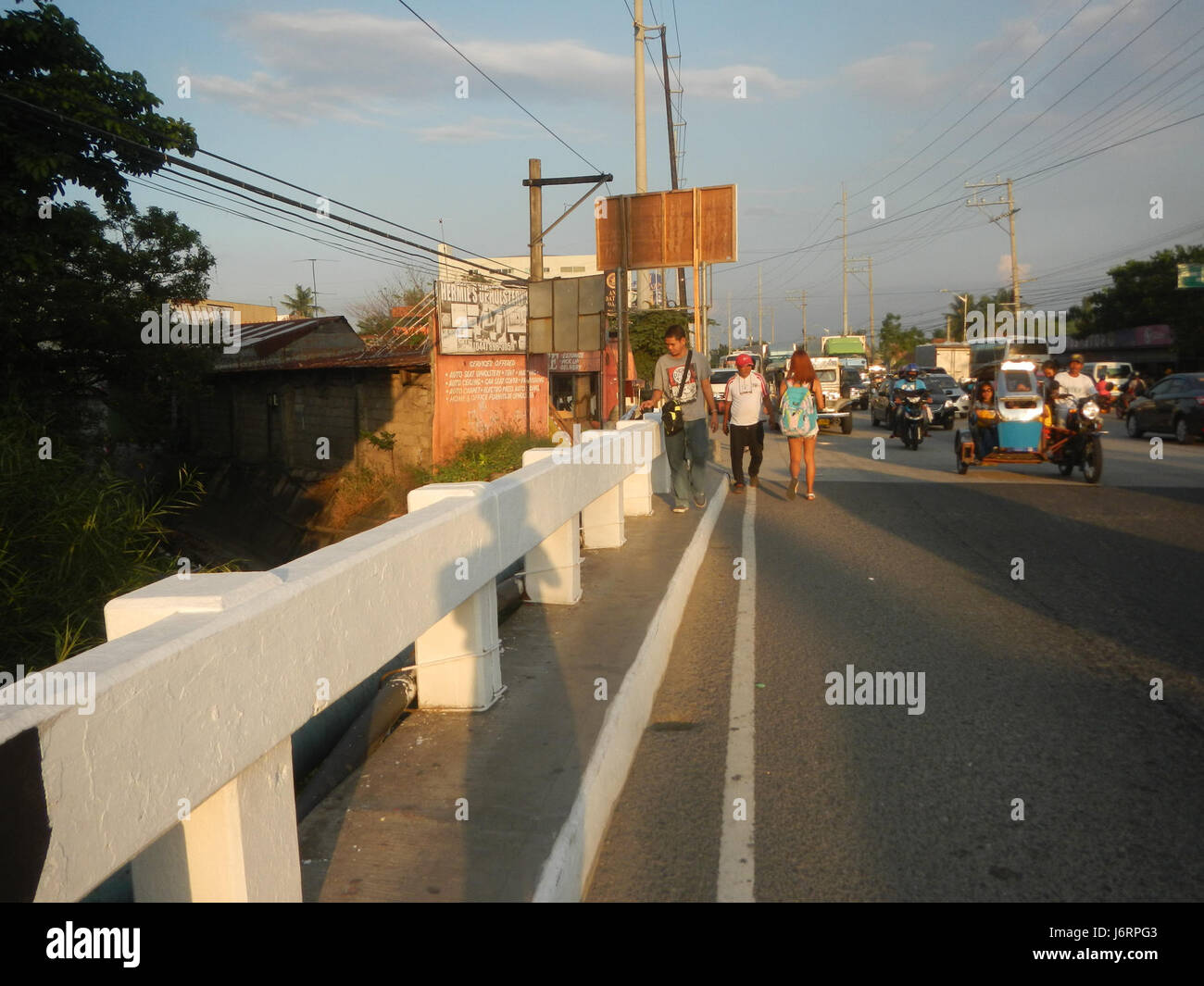 The image depicts the Malolos City overpass bridge located on MacArthur ...