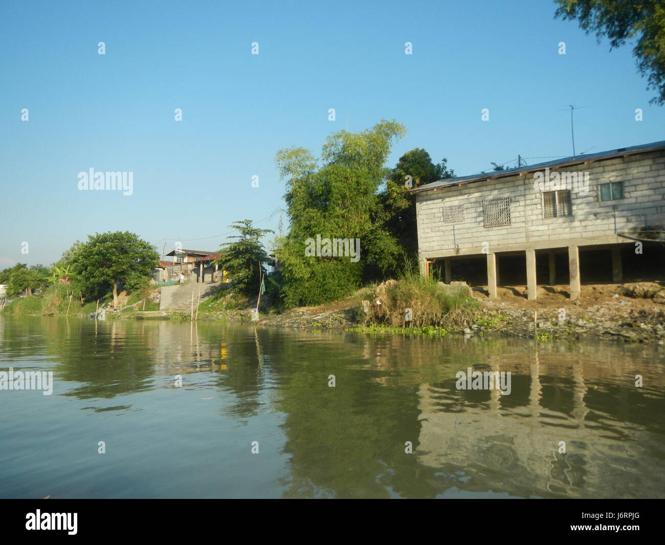 This image depicts the riverside districts along the Pampanga River ...