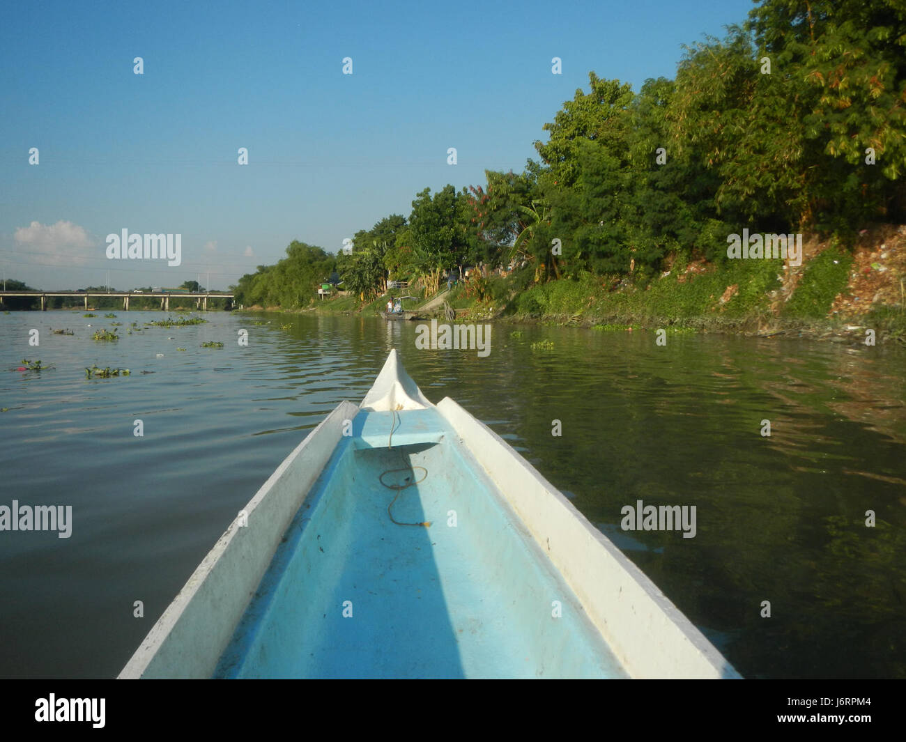 This image depicts a scenic view of the riverside districts in Calumpit ...