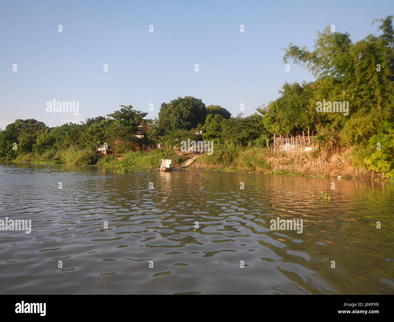 This image depicts the scenic riverside districts of Calumpit, Bulacan ...