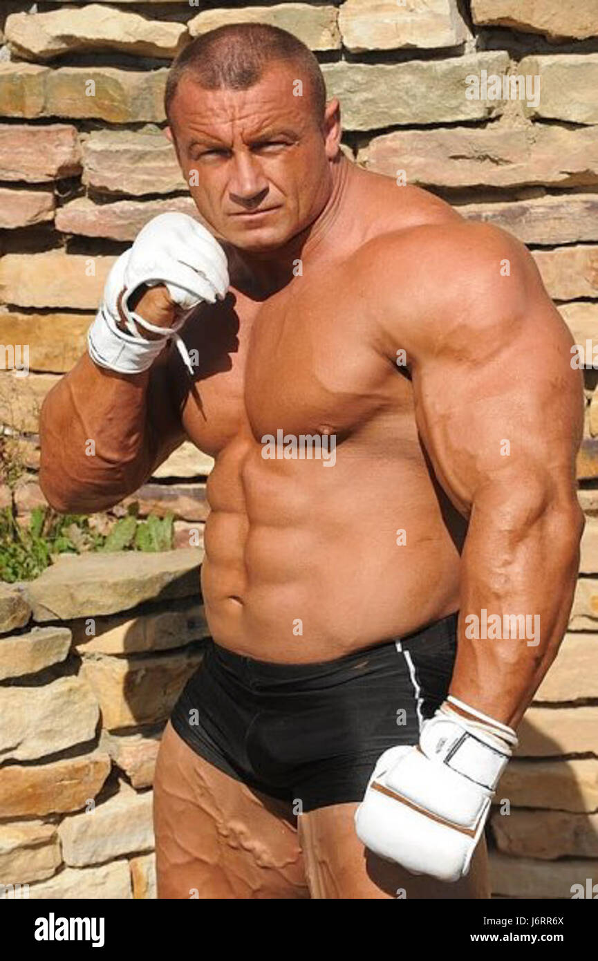 This image features Mariusz Pudzianowski, a Polish strongman and ...