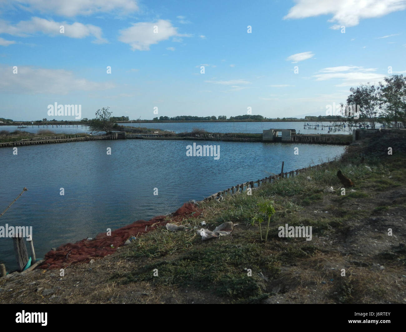 The image depicts the riverbanks of the Panasahan and San Nicolas ...