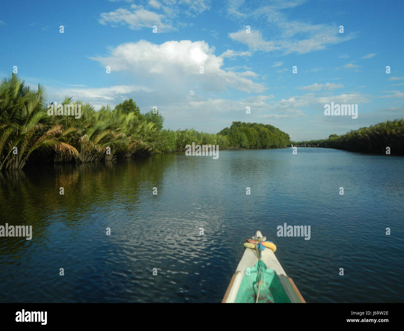 This photograph captures the riverbanks along the Malolos Bulakan River ...