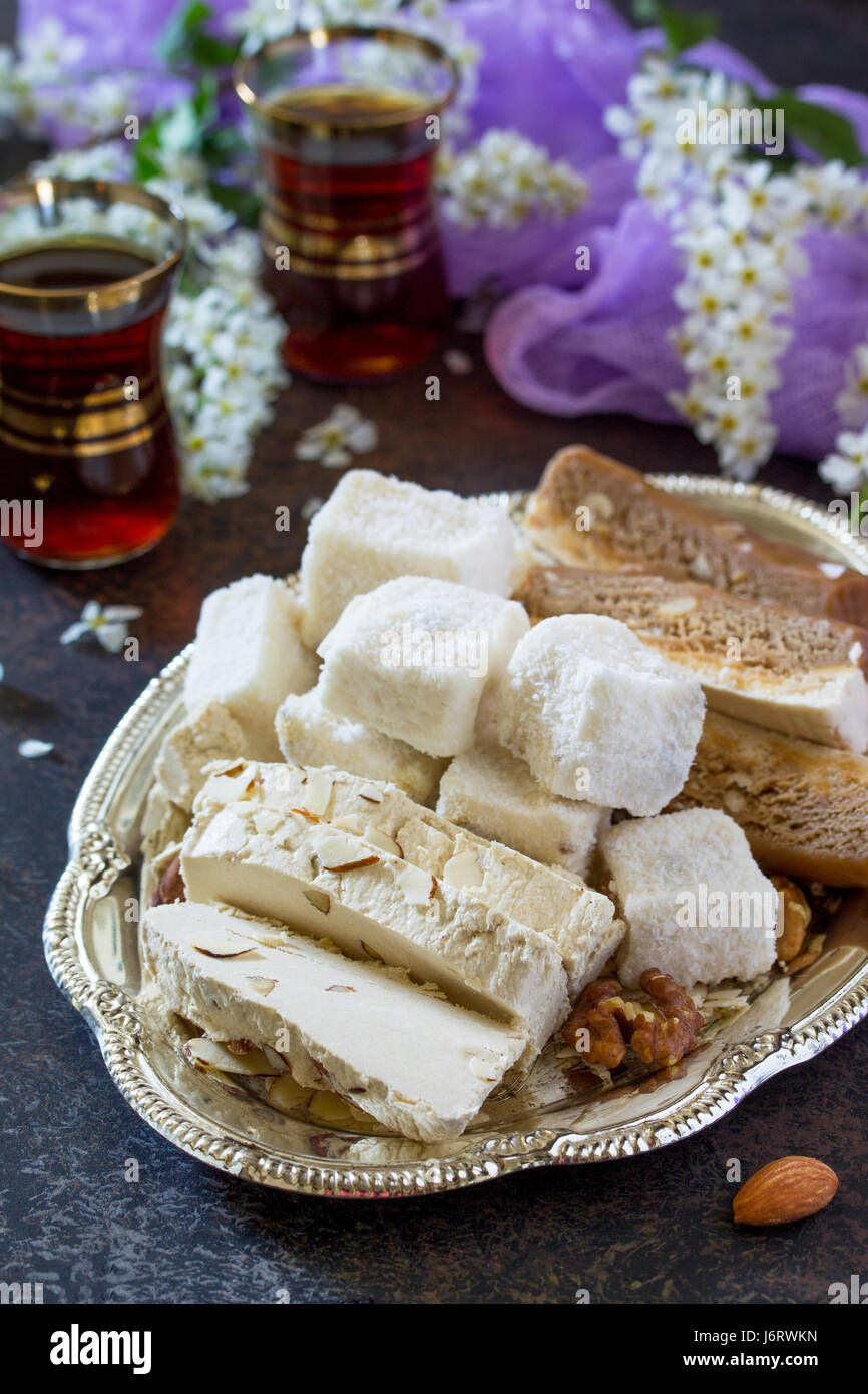 Rahat Lukum, sherbet, halva and tea on the kitchen table. Turkish and ...