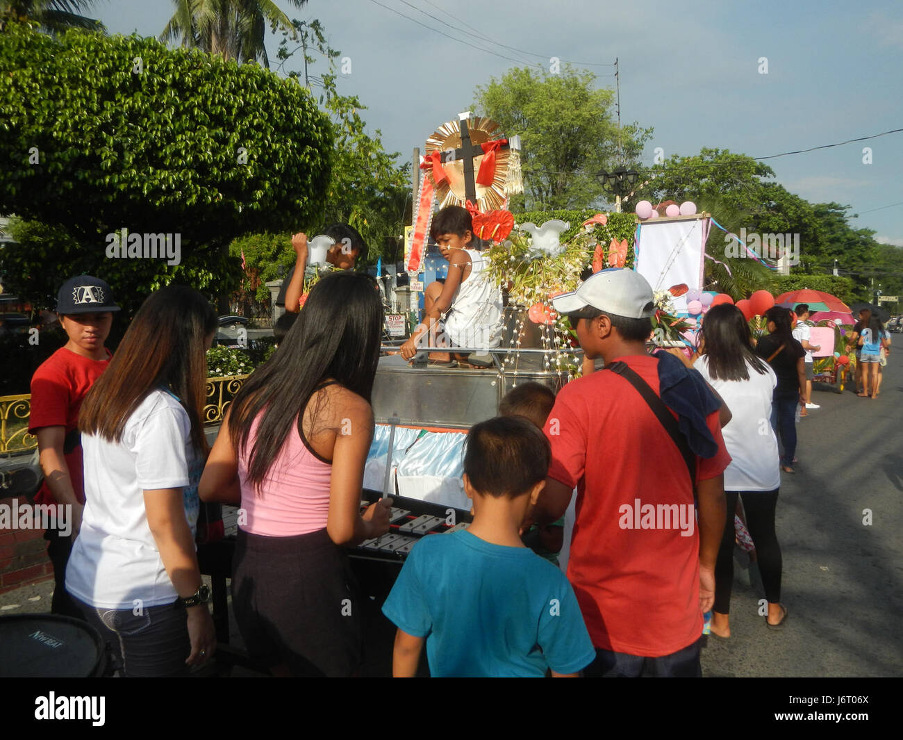 This title describes the Holy Cross Fiesta Patronales Procession in ...