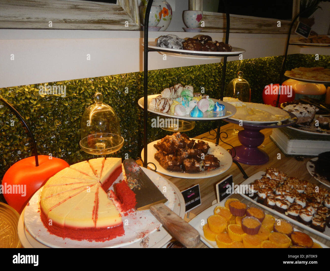 This image shows a variety of cakes and pastries available at buffets ...