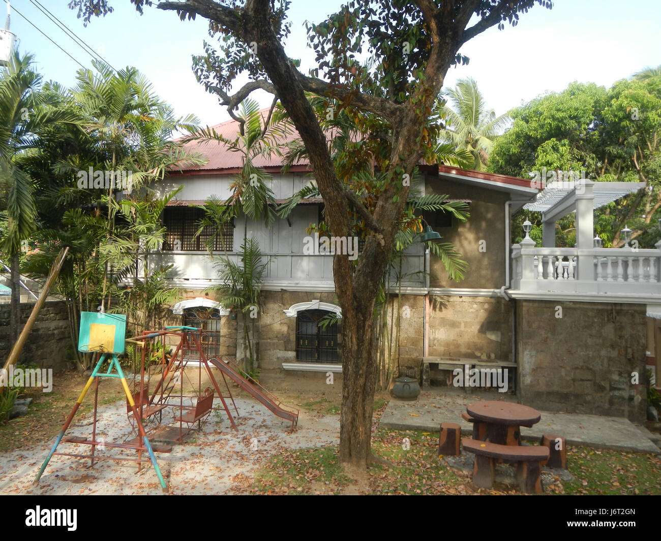 This image features the house of Bonifacio Enriquez located in San Jose ...