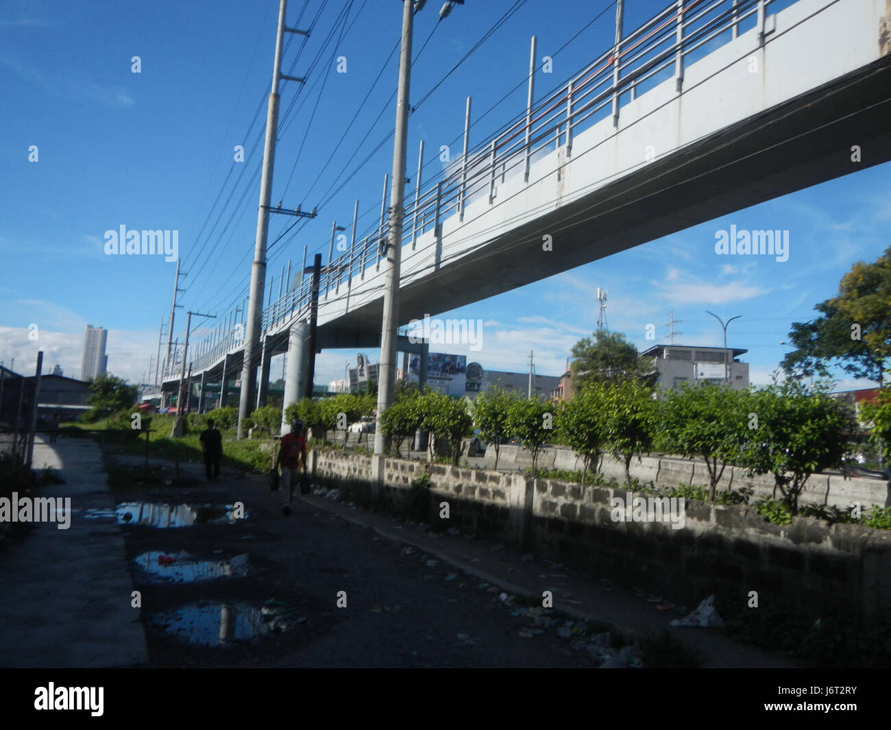 This photograph shows a footbridge along Marcos Highway near Pasig ...