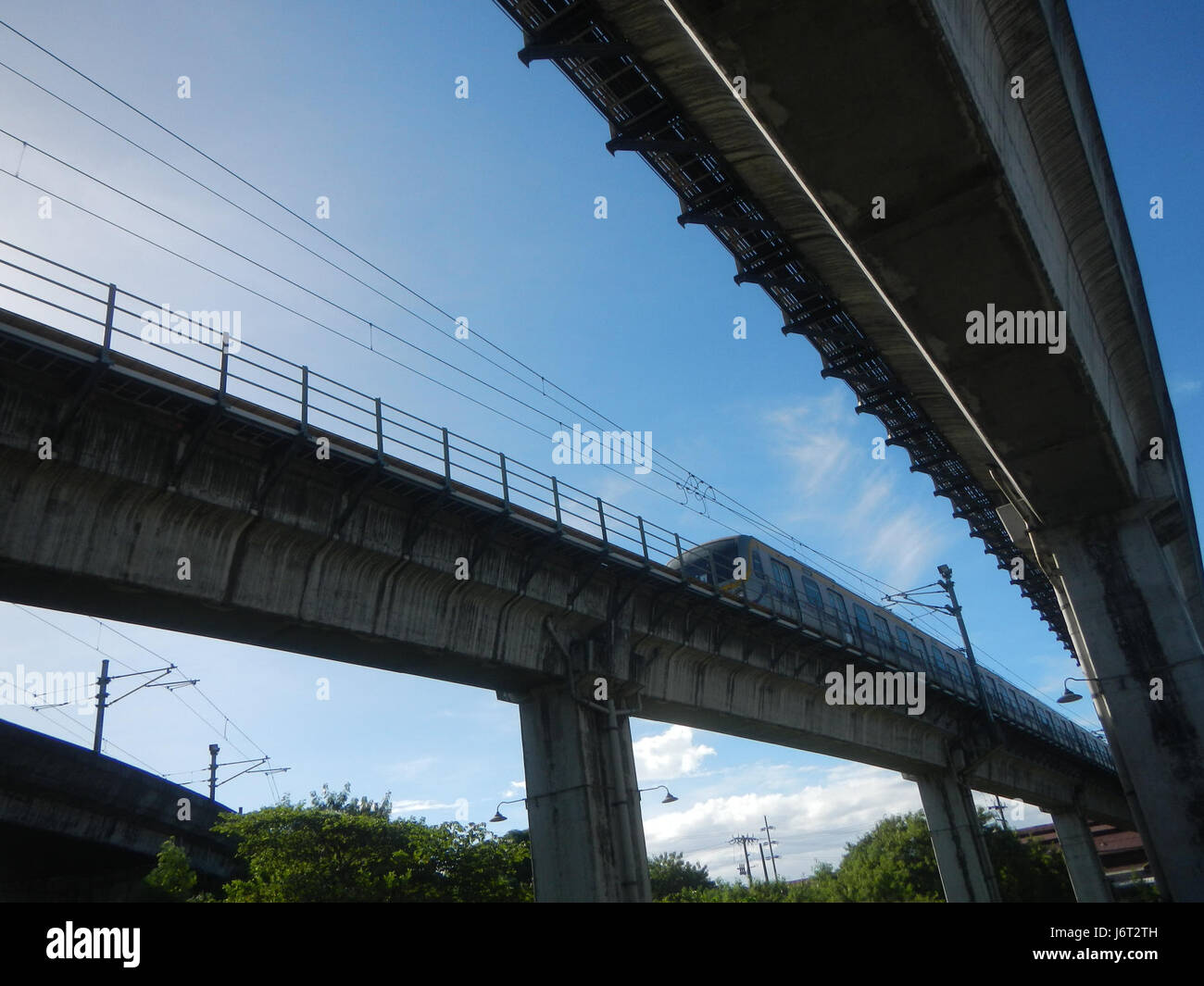 This image shows a footbridge over Marcos Highway in Pasig, near the ...