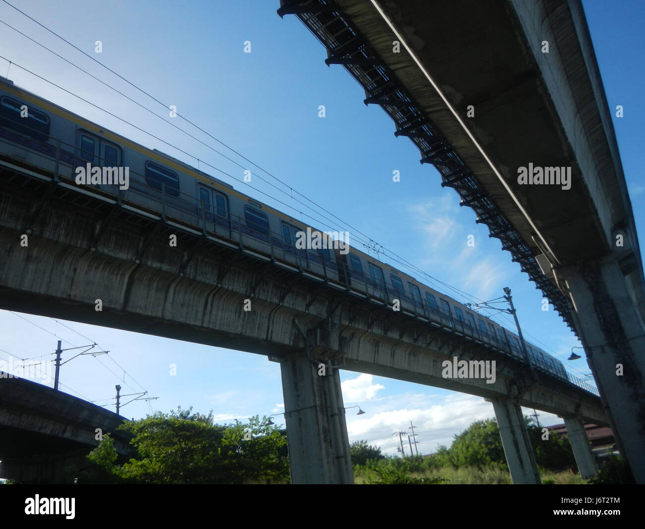 This image depicts a footbridge along the Marcos Highway in Pasig ...