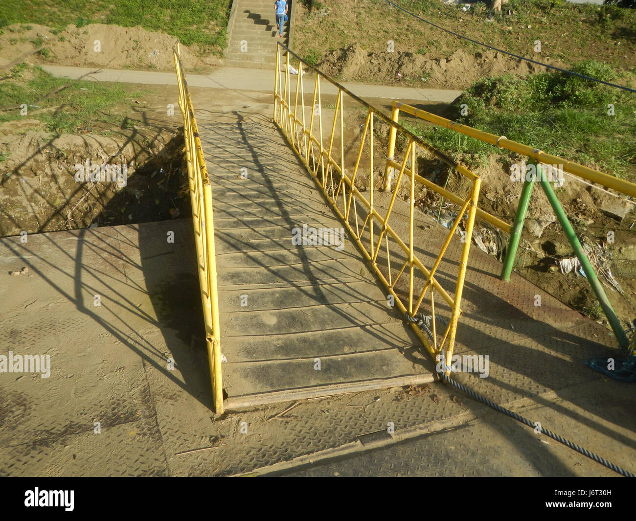 This image features the Marikina Riverbanks Park and the Marcos Bridge ...