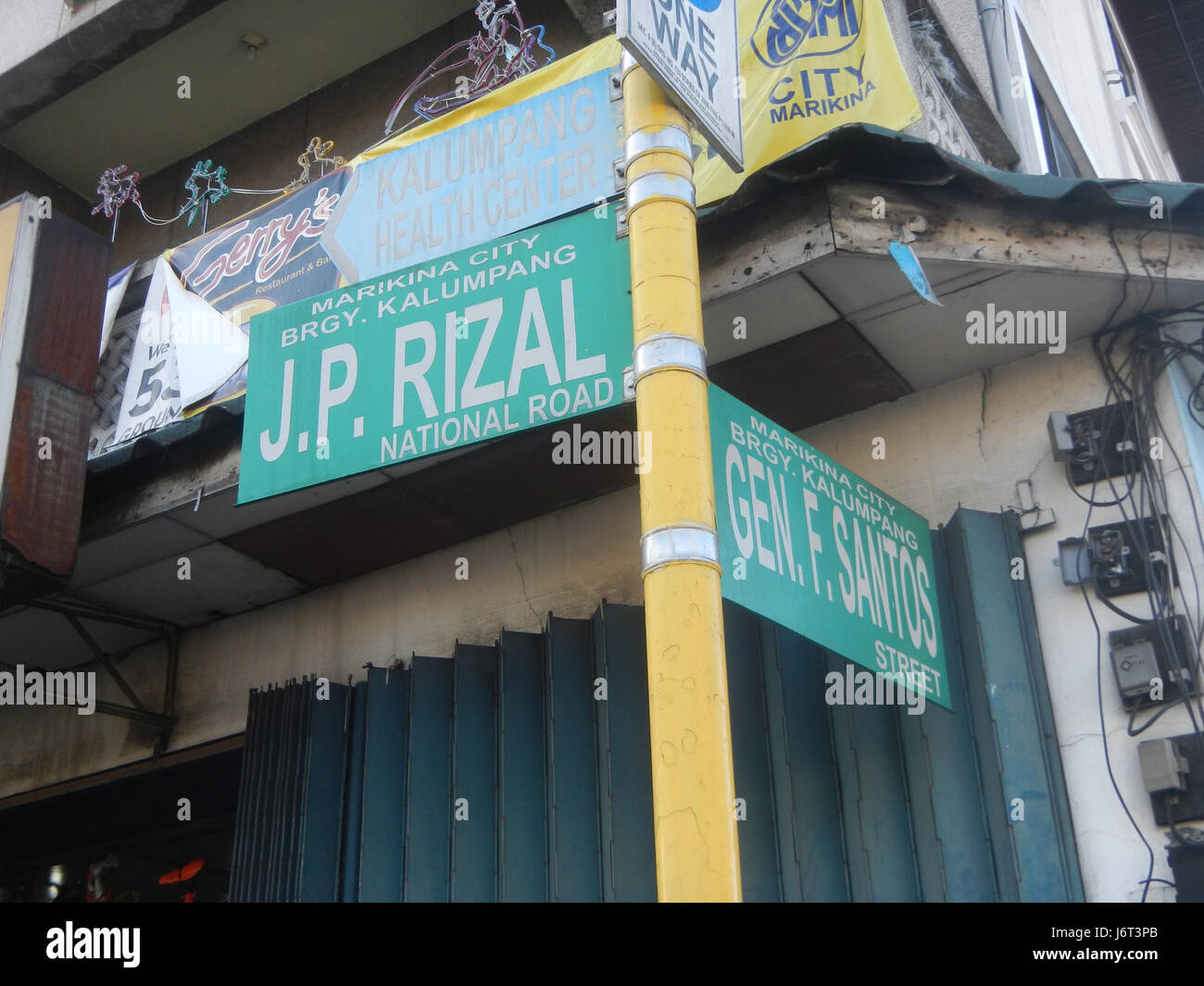 The image portrays the streets of Calumpang, located along Marcos ...