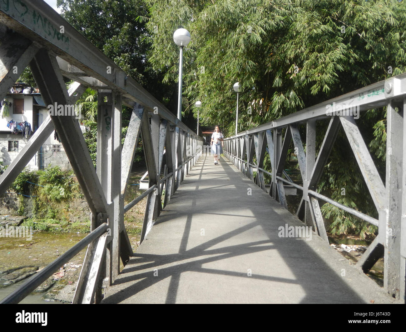 The image features the Ermin Garcia Street Footbridge, spanning across ...
