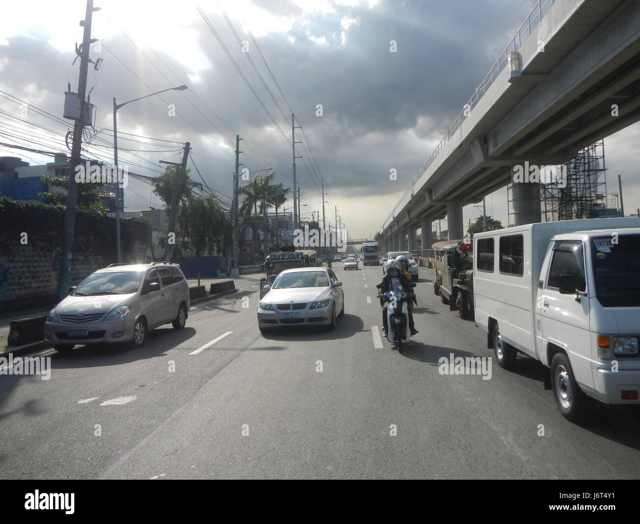 This image captures the landscape along the Manila MRT Line 22 ...