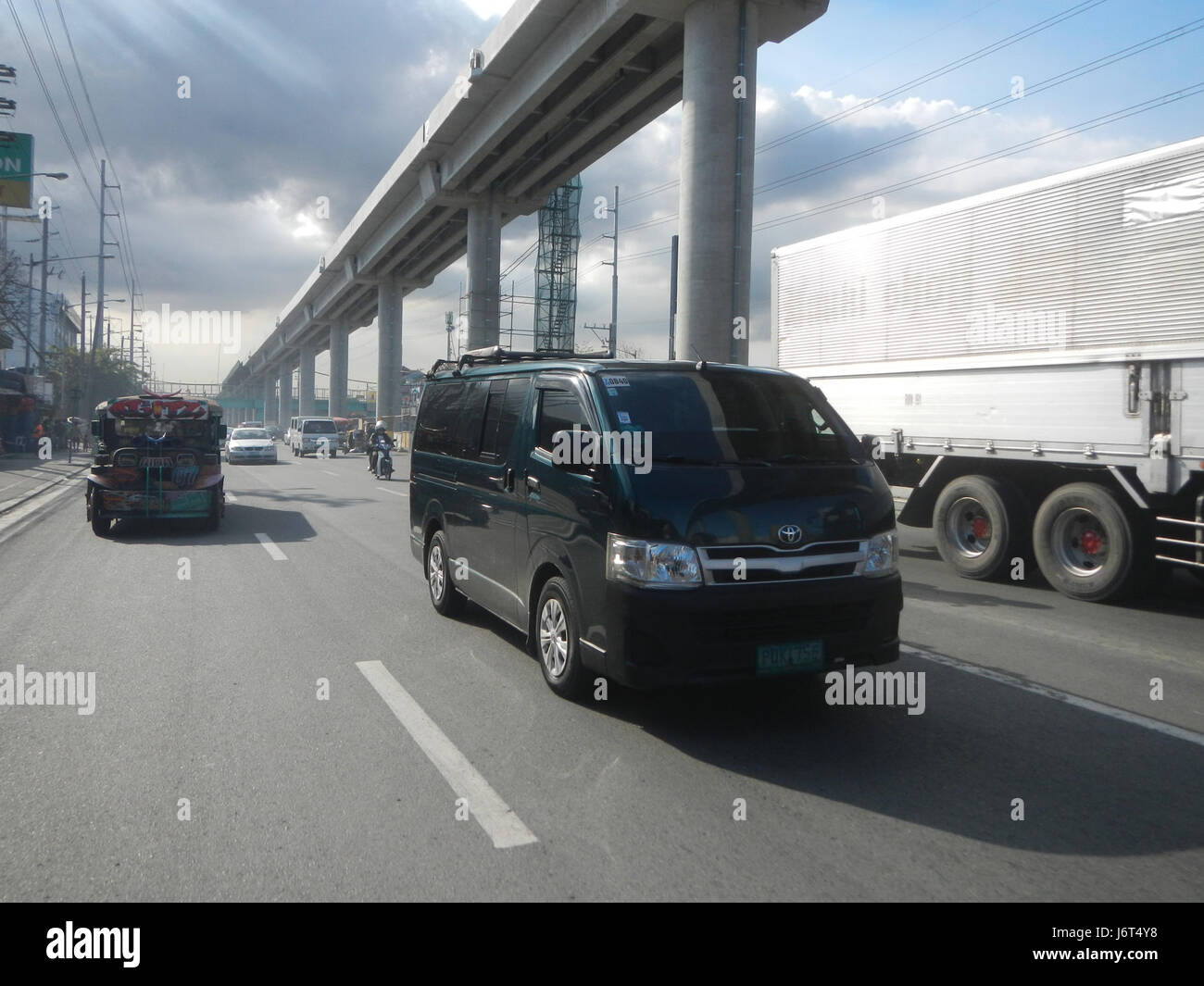 This title describes a landscape view of the Manila MRT Line 4 ...