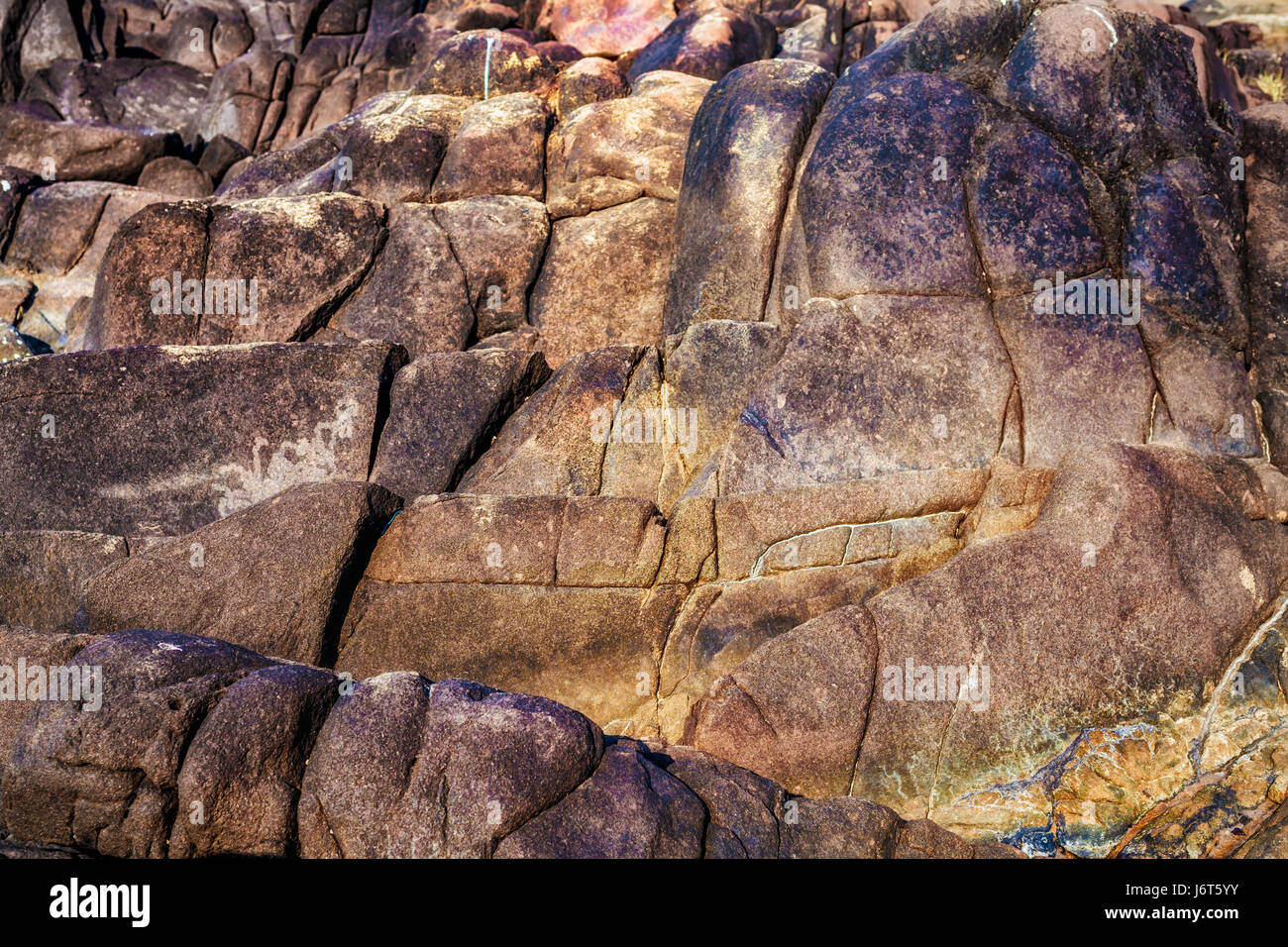 Stone bright multi-colored texture of natural rock Stock Photo - Alamy